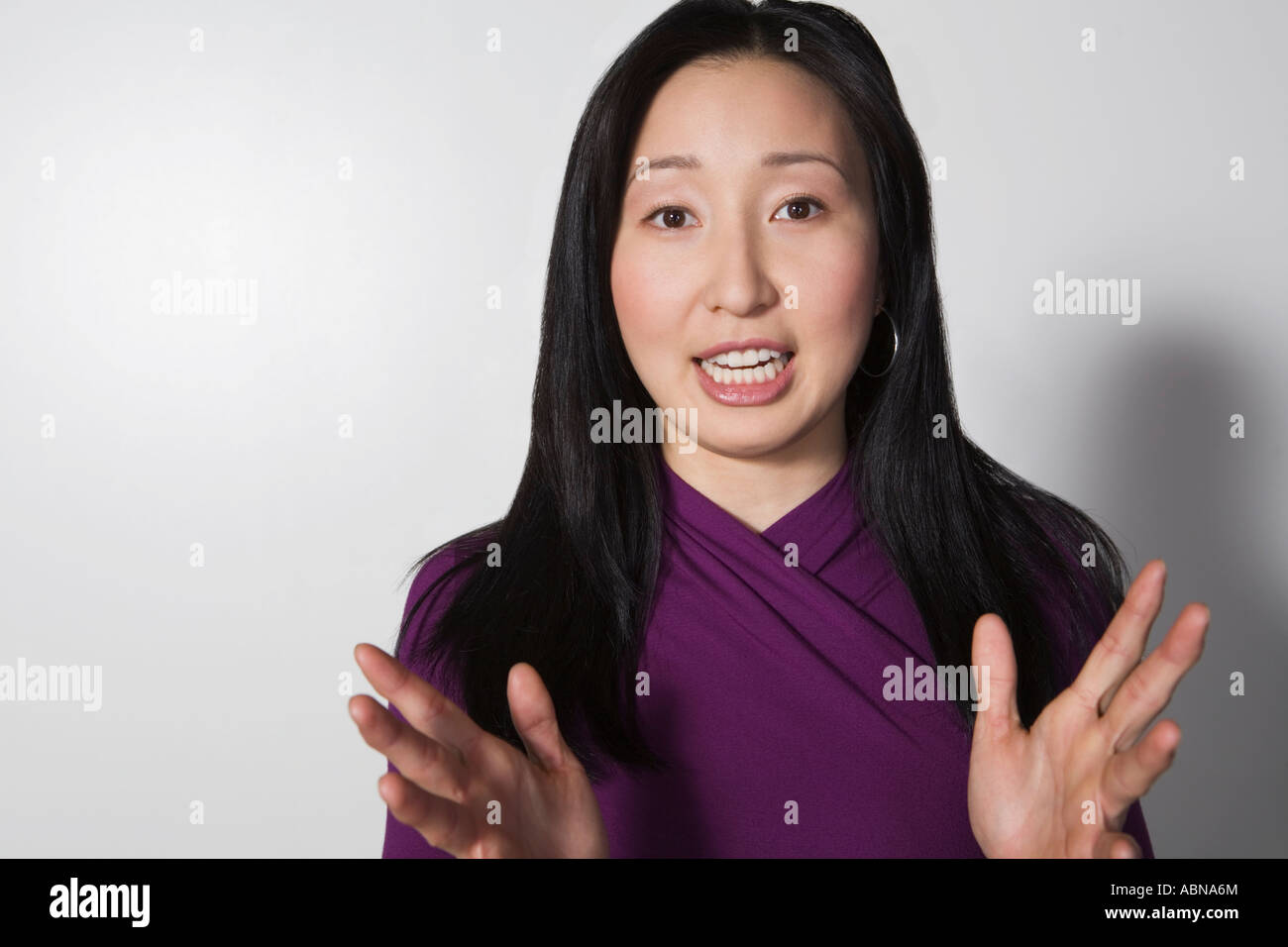 Woman gesturing hands open mouth hi-res stock photography and images ...