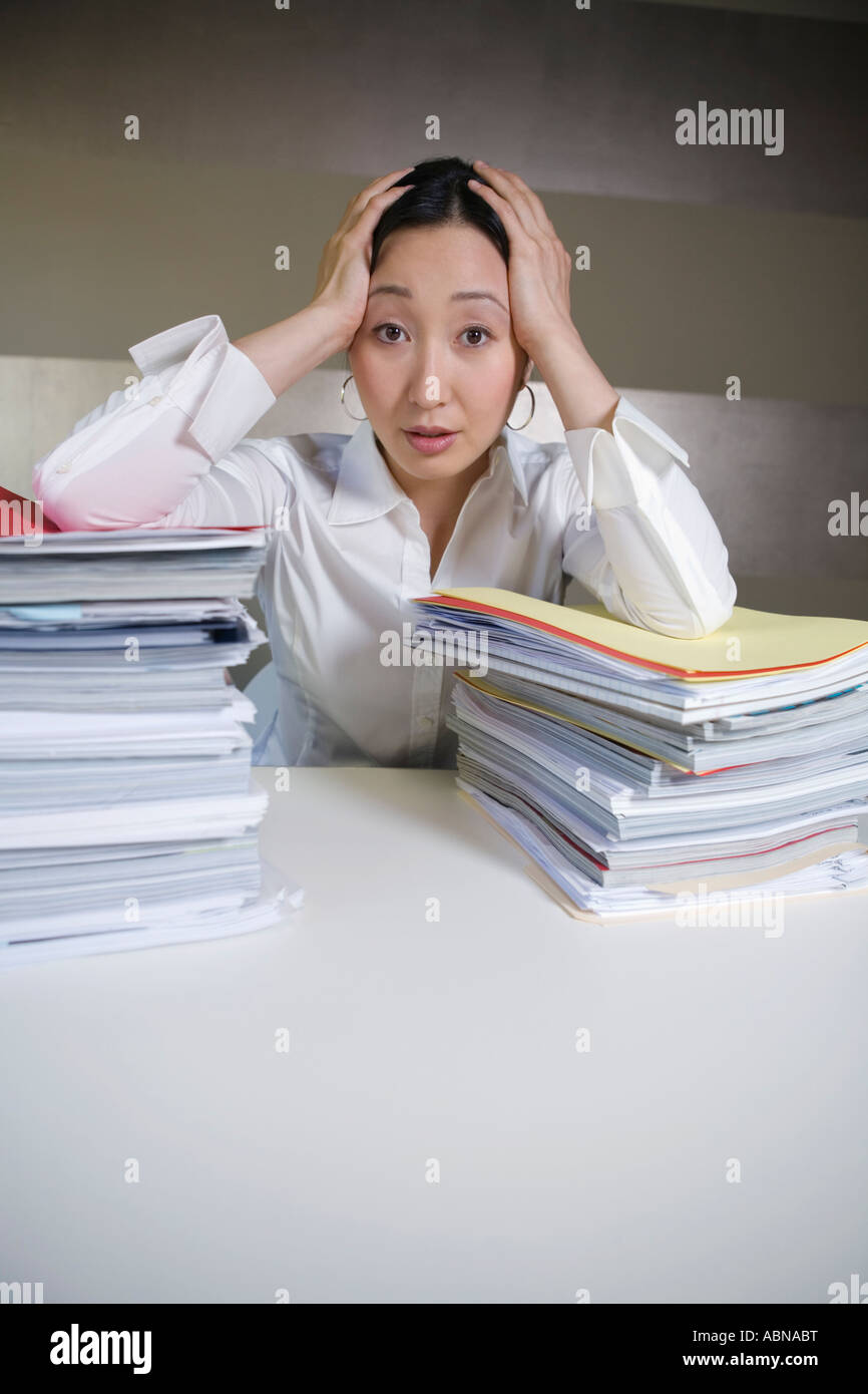 Woman office desk piles of paperwork hi-res stock photography and ...