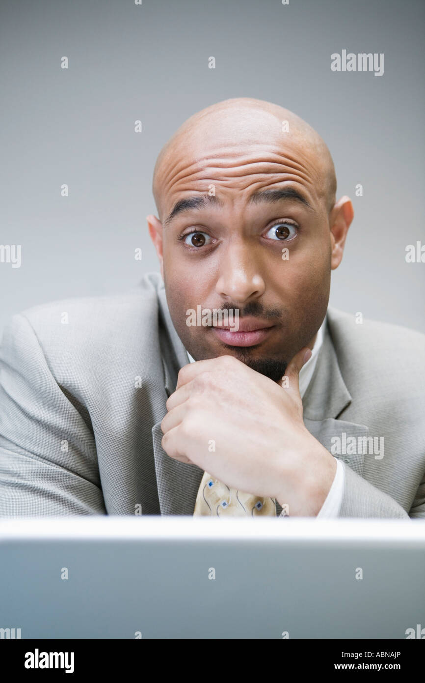 Businessman raising his eyebrows Stock Photo - Alamy