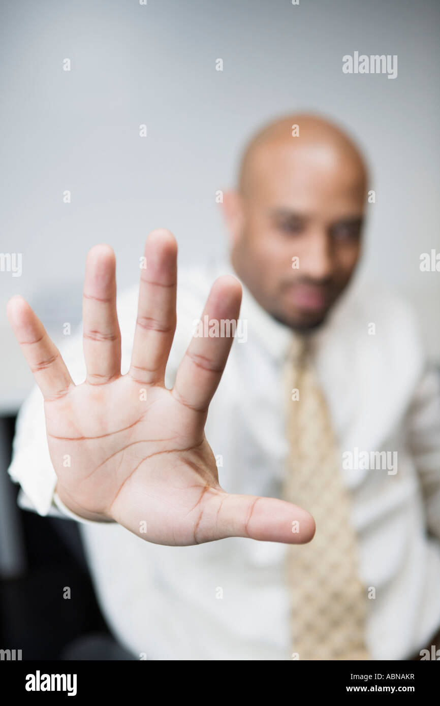 Businessman blocking camera hand hi-res stock photography and images ...