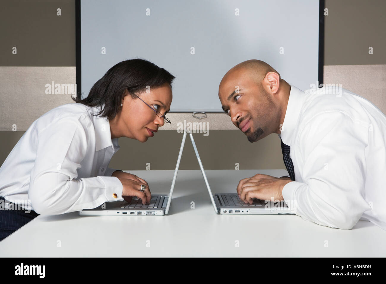 Businesspeople working at separate laptops Stock Photo - Alamy