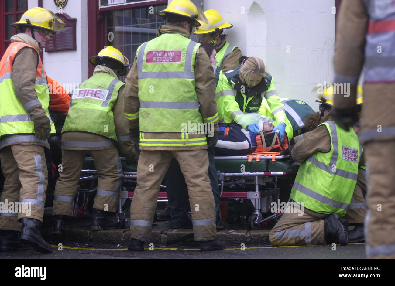 Emergency services look after a man at the scene of a road traffic ...