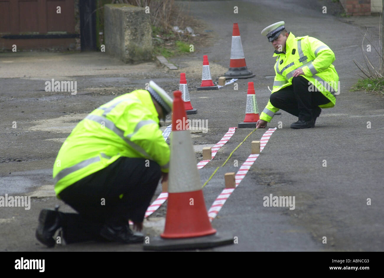 Police mark out the movement of vehicles at a murder scene UK Stock ...