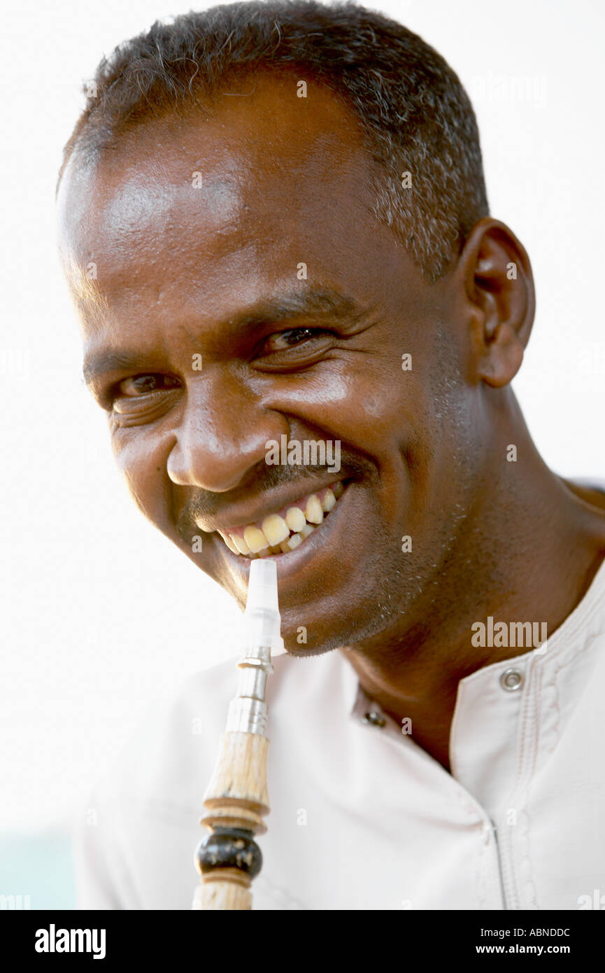 Nubian man smoking shashi in village near Aswan Egypt Stock Photo - Alamy