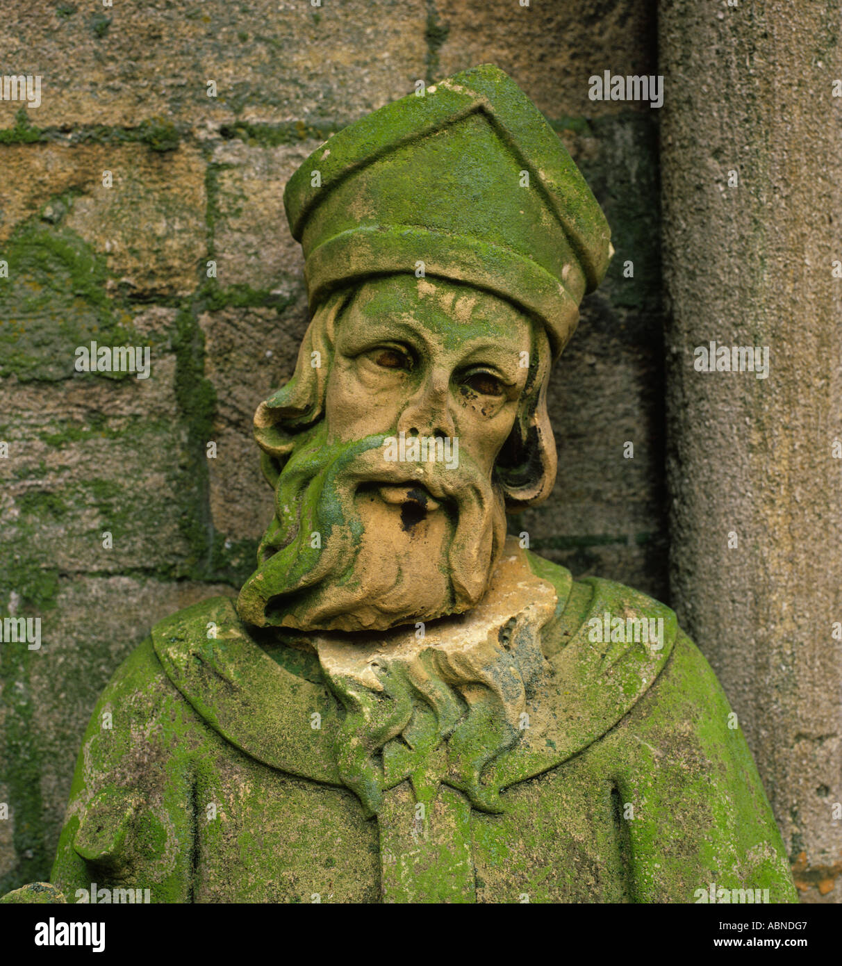 Lincolnshire Crowland Abbey mossy medieval stone figure in churchyard ...