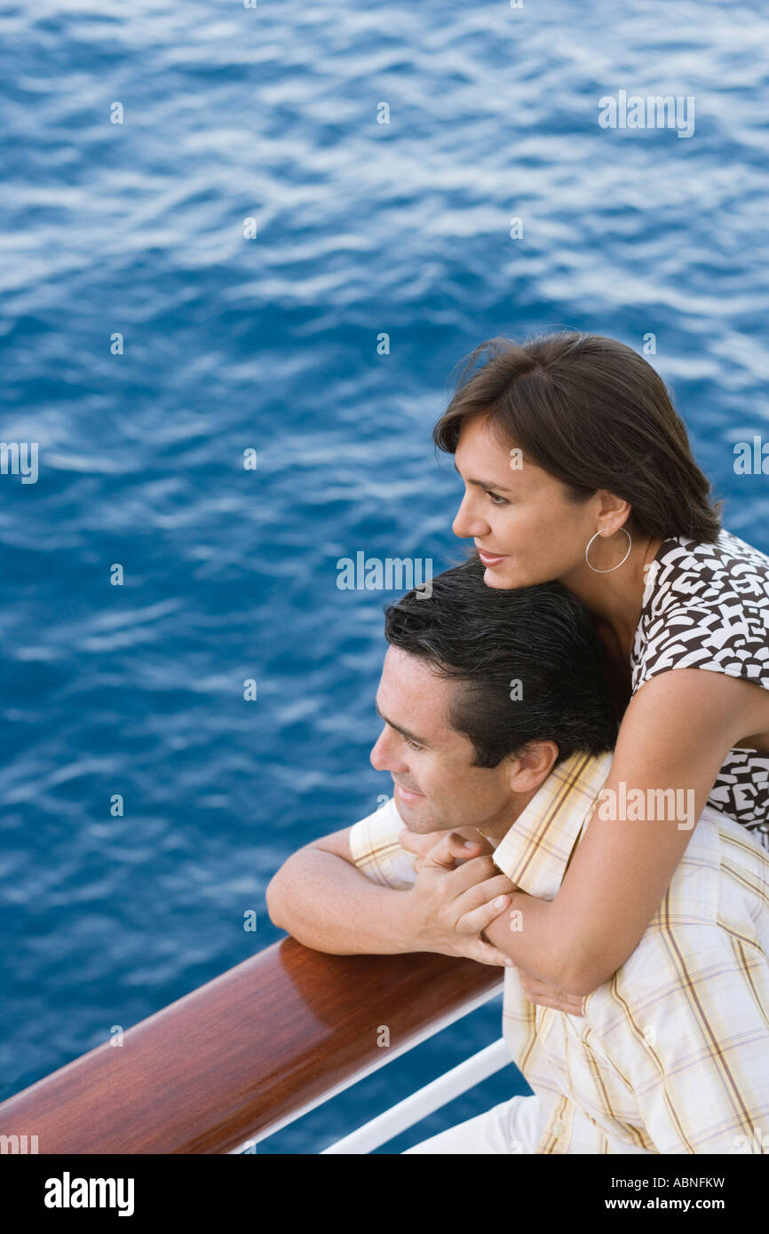Couple standing on ship deck Stock Photo - Alamy