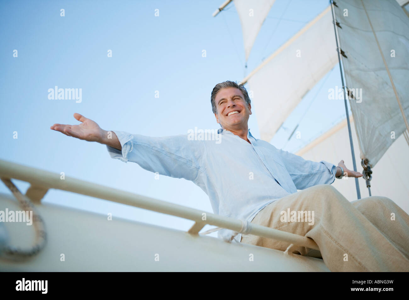 Man balancing on ship’s railing Stock Photo - Alamy