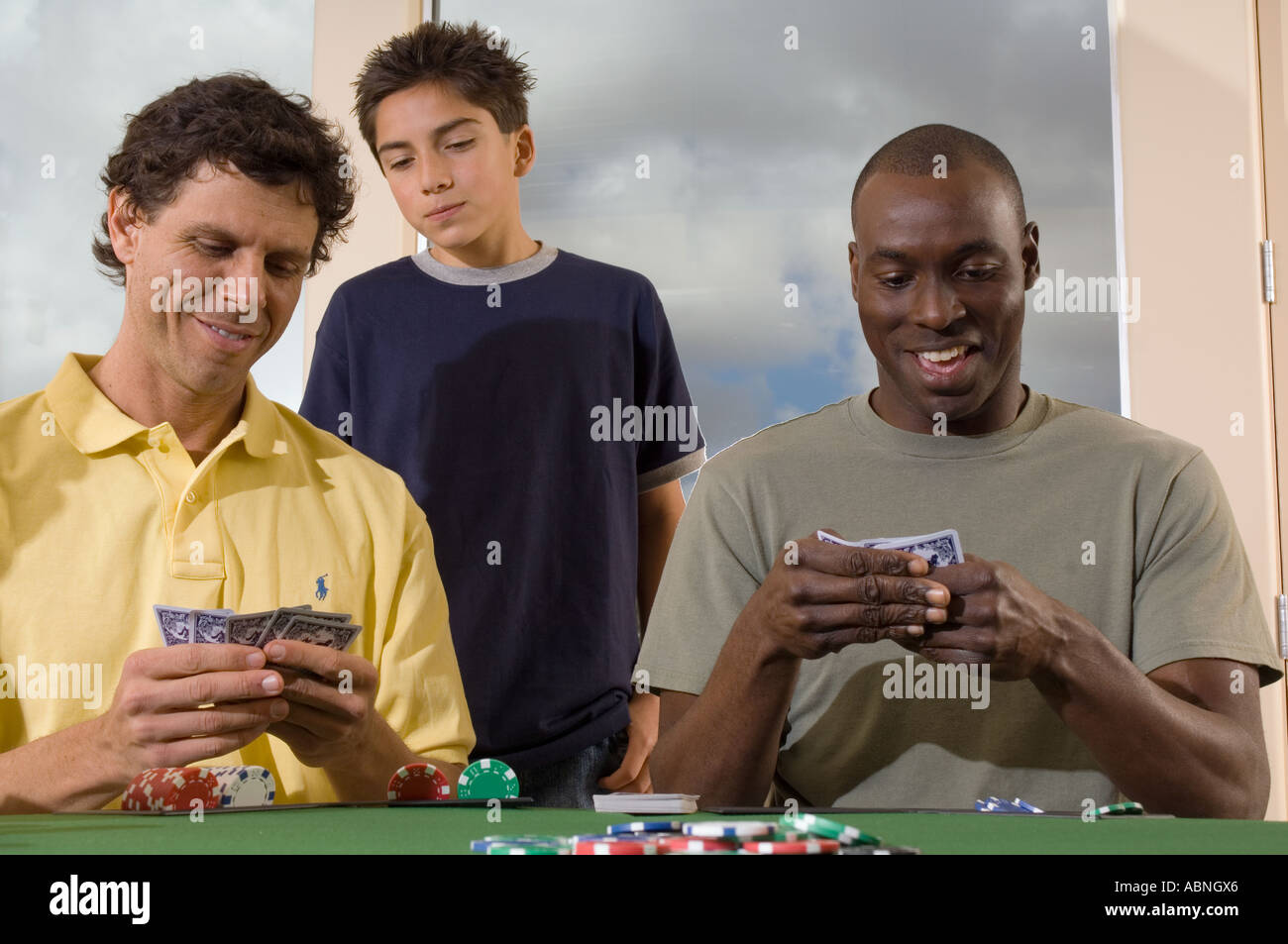 Portrait of men playing cards Stock Photo - Alamy