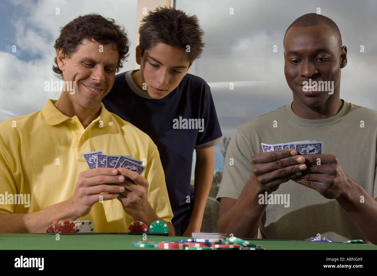 Portrait of men playing cards Stock Photo - Alamy