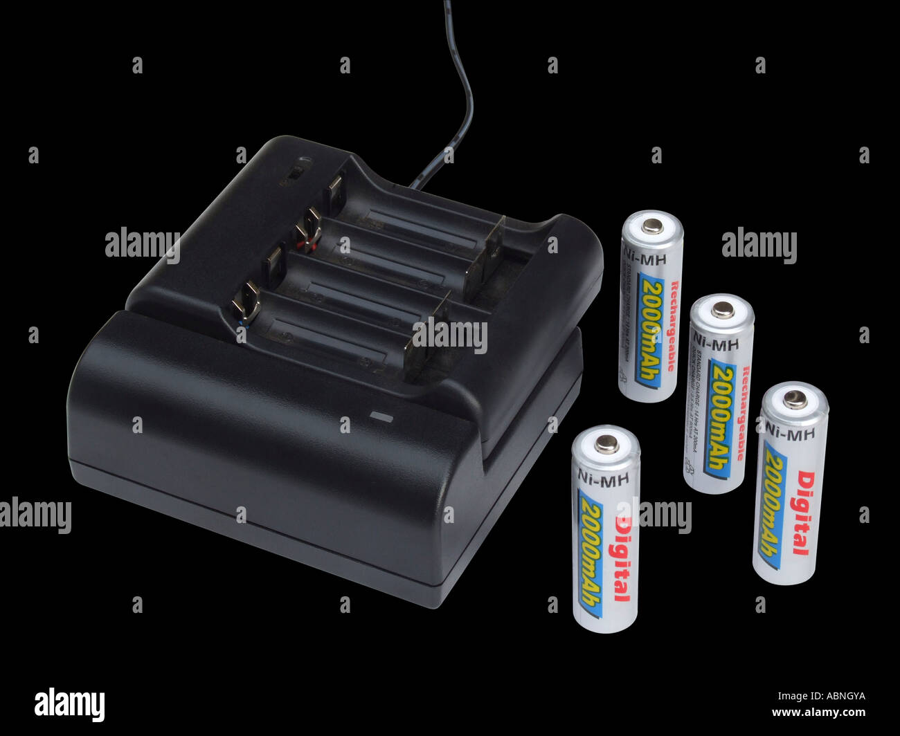 Battery charger with four AA rechargeable batteries on a black ...
