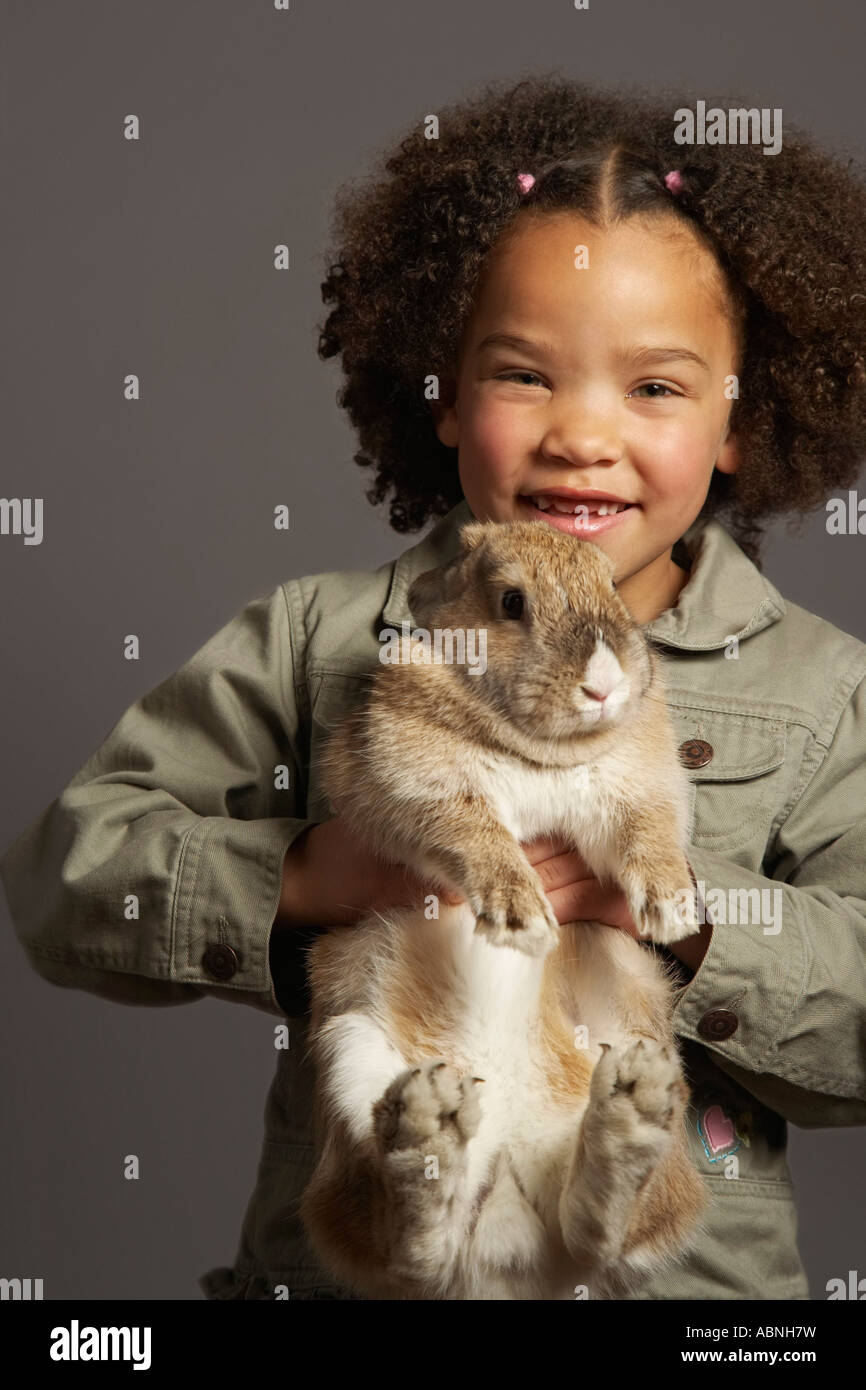Girl Holding Rabbit Stock Photo - Alamy