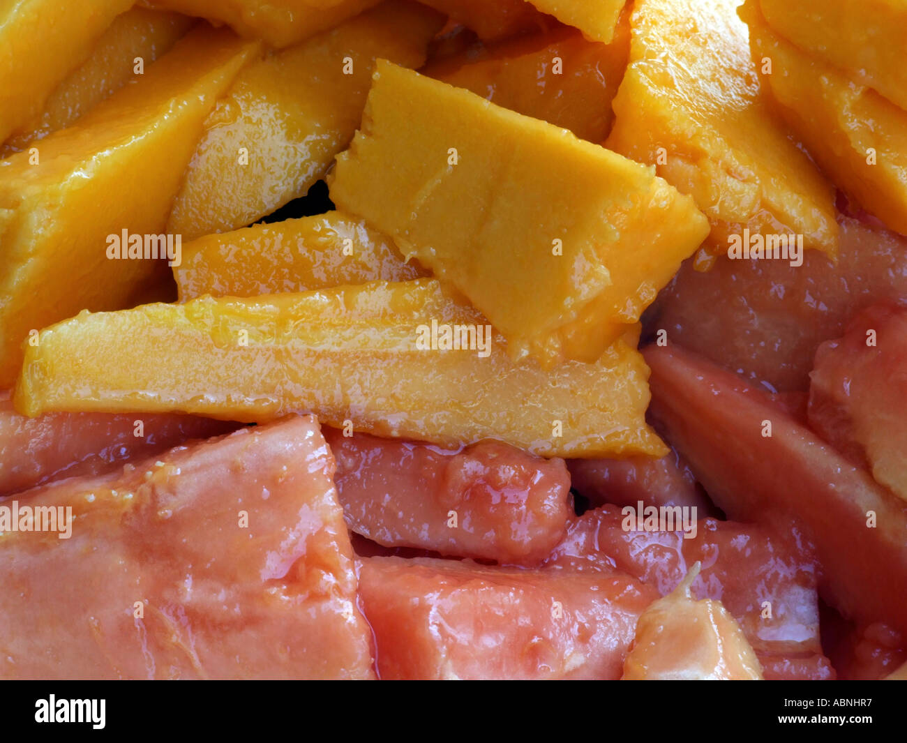 Pieces of cut papaya Stock Photo - Alamy