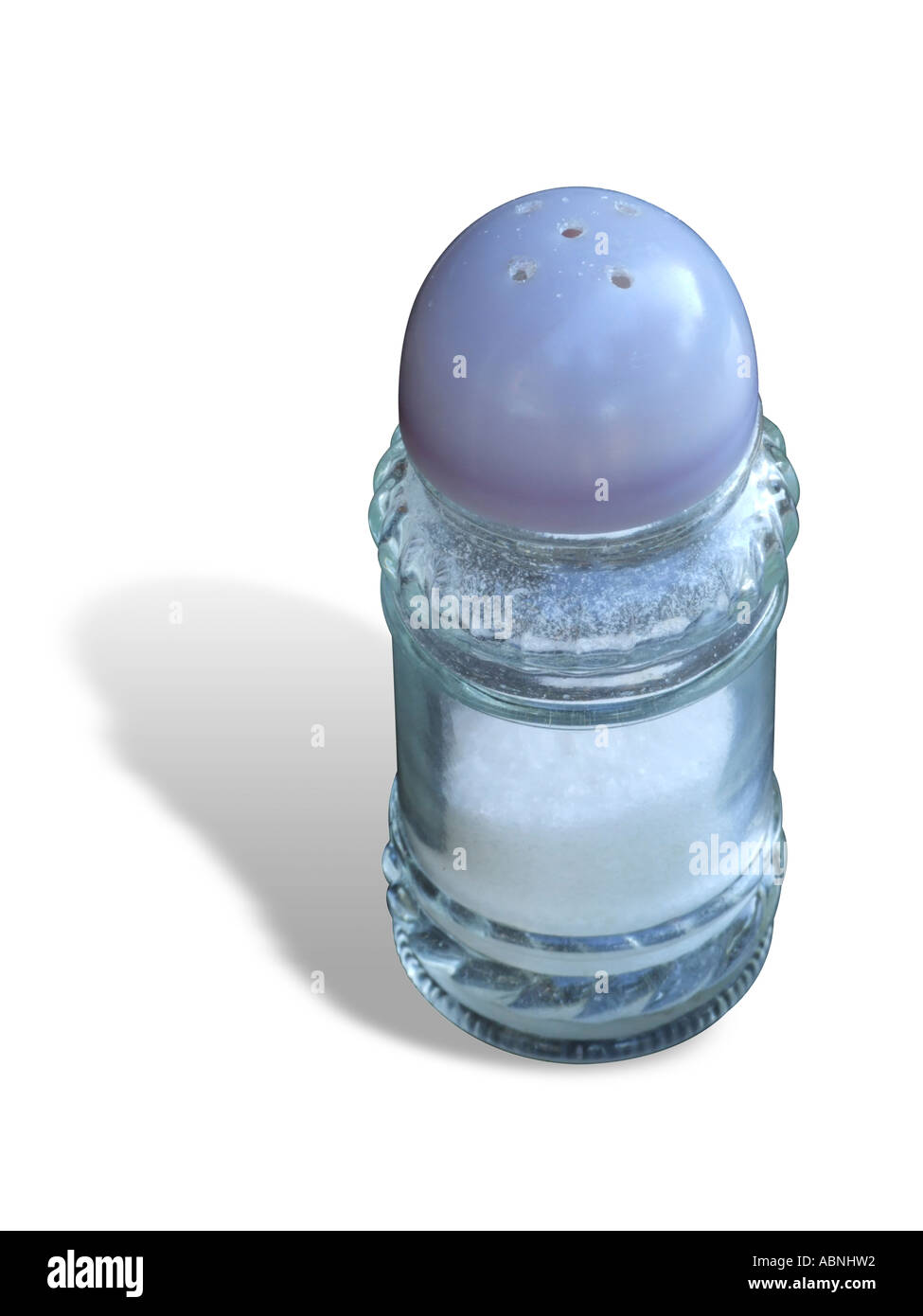 Salt shaker made of glass with plastic top on a white background with a ...