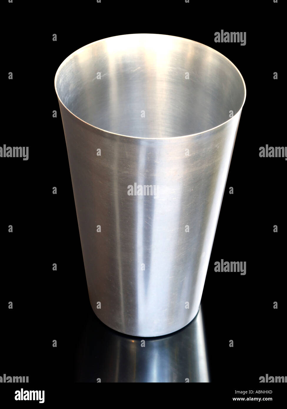 Metal drinking beaker on a black background with reflection Stock Photo ...