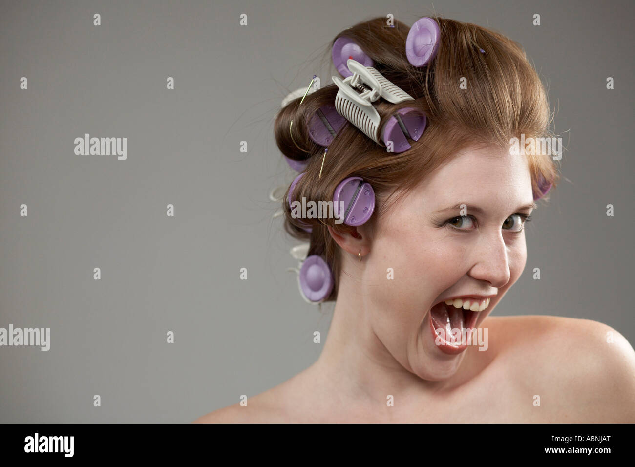 Woman with Curlers in Hair Stock Photo - Alamy