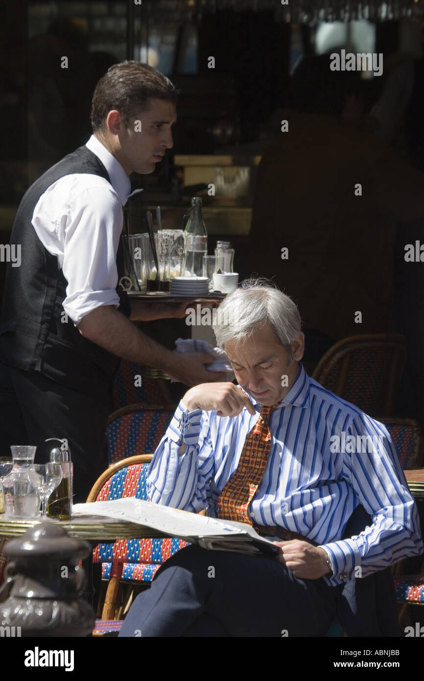 Paris cafe newspaper read hi-res stock photography and images - Alamy