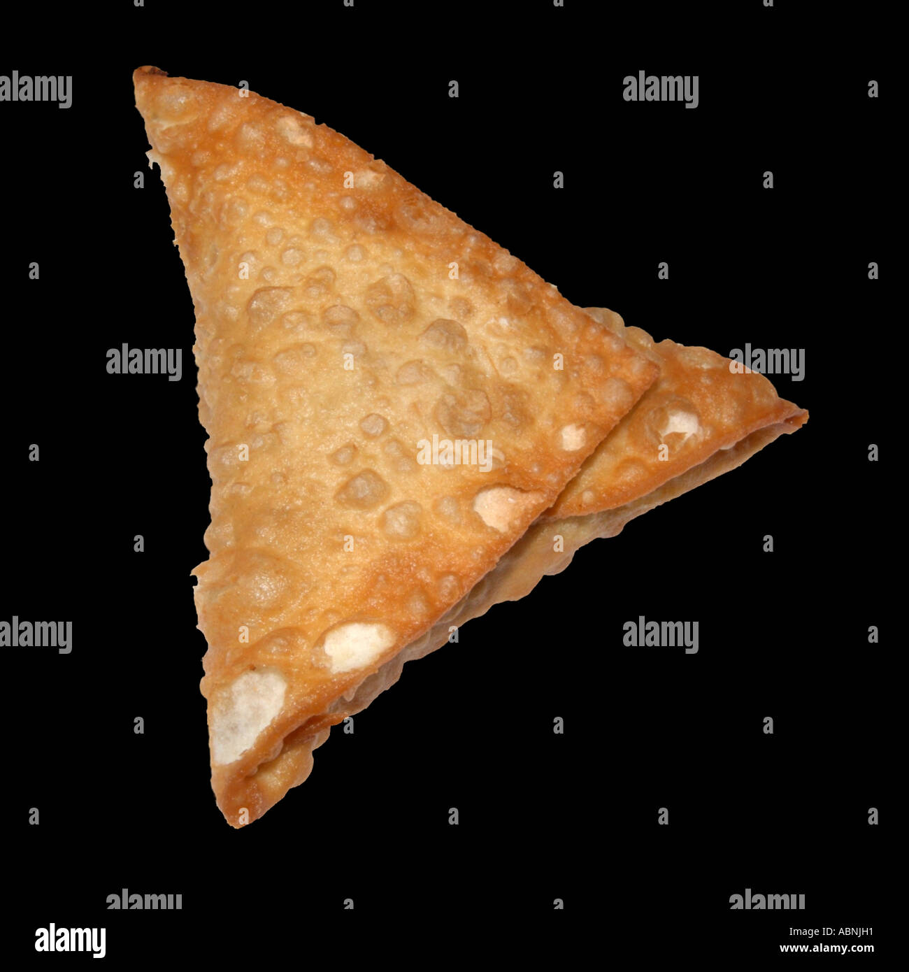 Samosa on a black background Stock Photo - Alamy