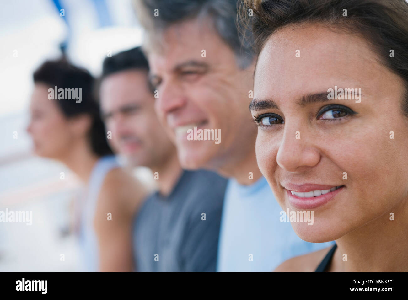 People sitting in a row Stock Photo - Alamy