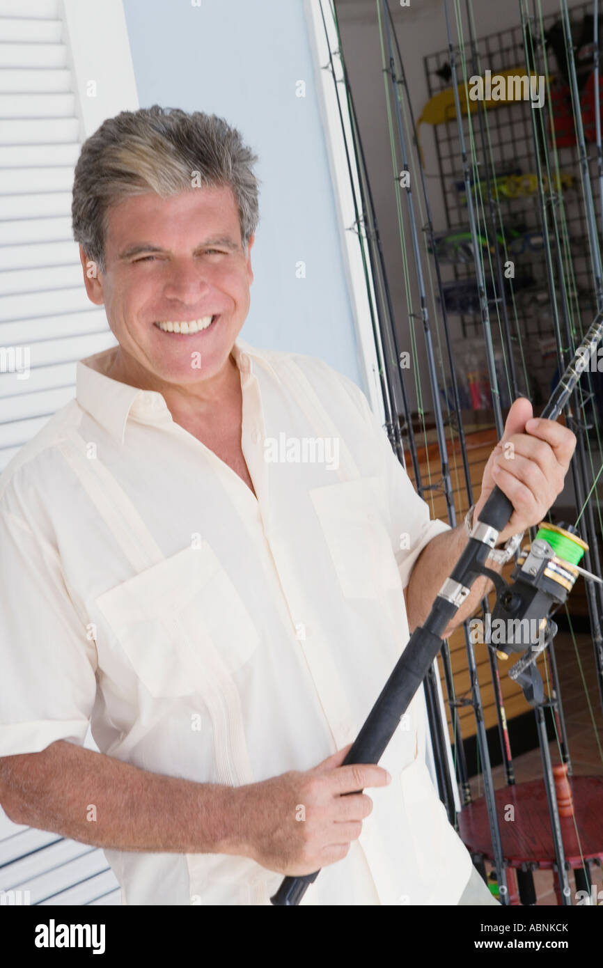 Person picking up fishing rod hi-res stock photography and images - Alamy