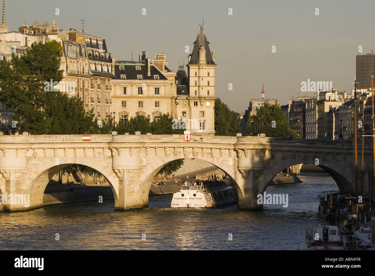 Vedettes du Pont Neuf cruise boat sails under the Pont Neuf bridge on ...