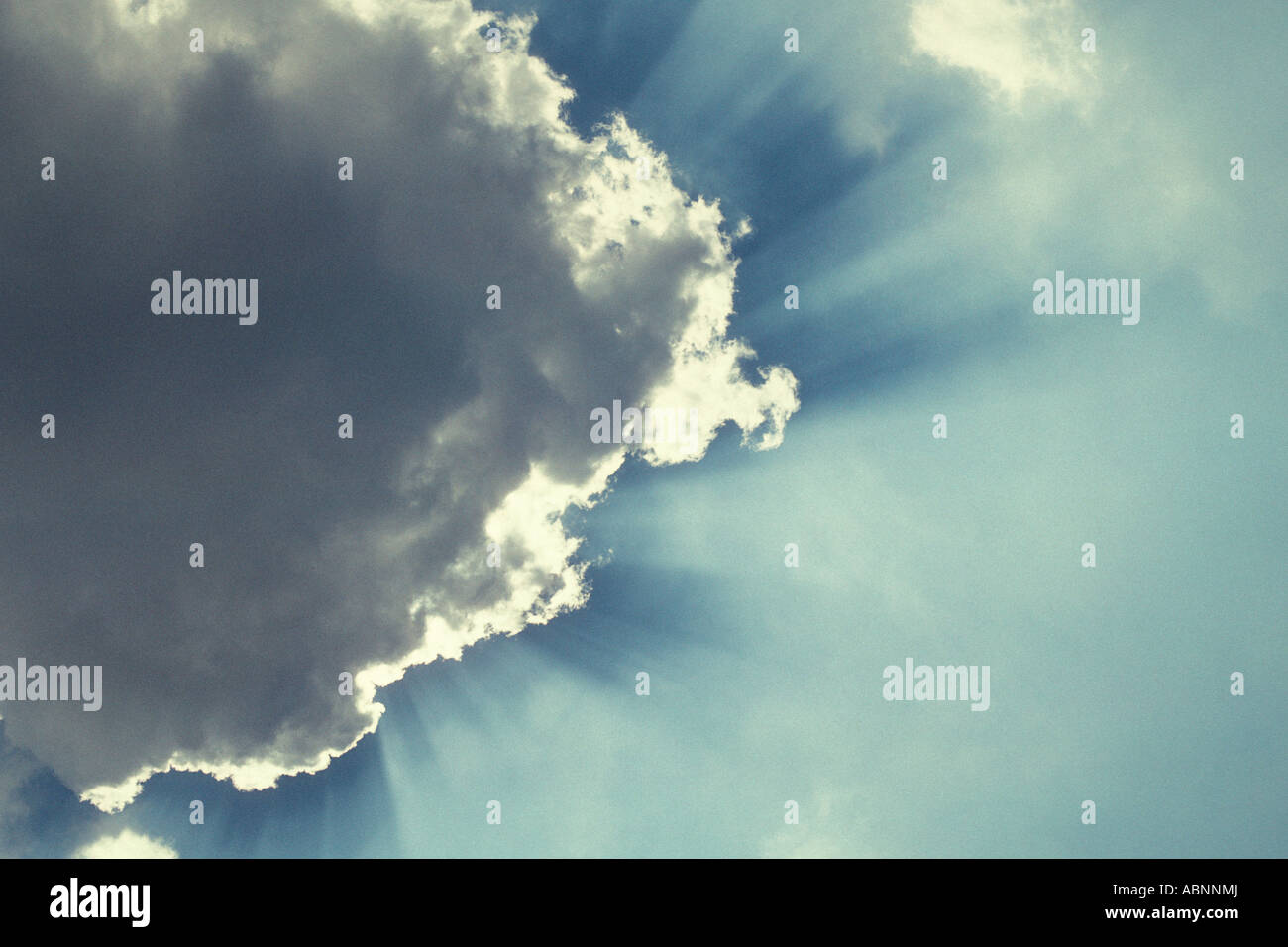 Cloud with sun rays Stock Photo - Alamy