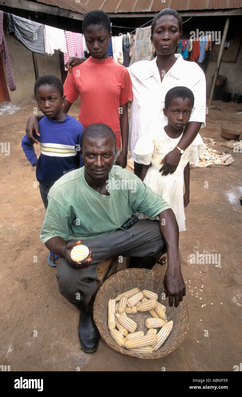 Ghana family with a bowl of homegrown maize in their yard Stock Photo ...