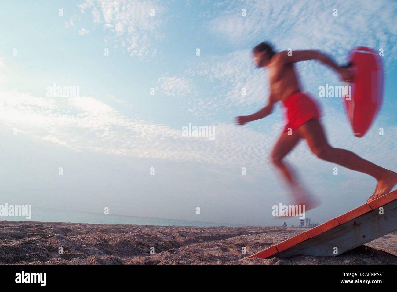 Male lifeguard running hi-res stock photography and images - Alamy