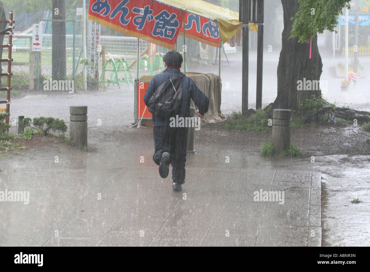 run in the heavy rain Stock Photo - Alamy