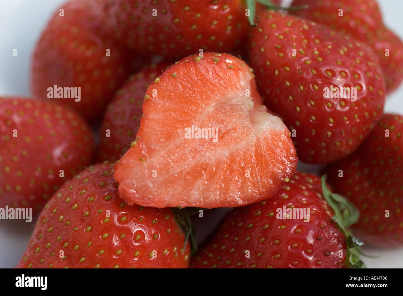 Delicious english strawberries cut open Stock Photo - Alamy