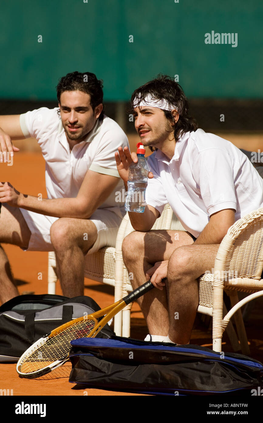Male tennis players resting Stock Photo - Alamy