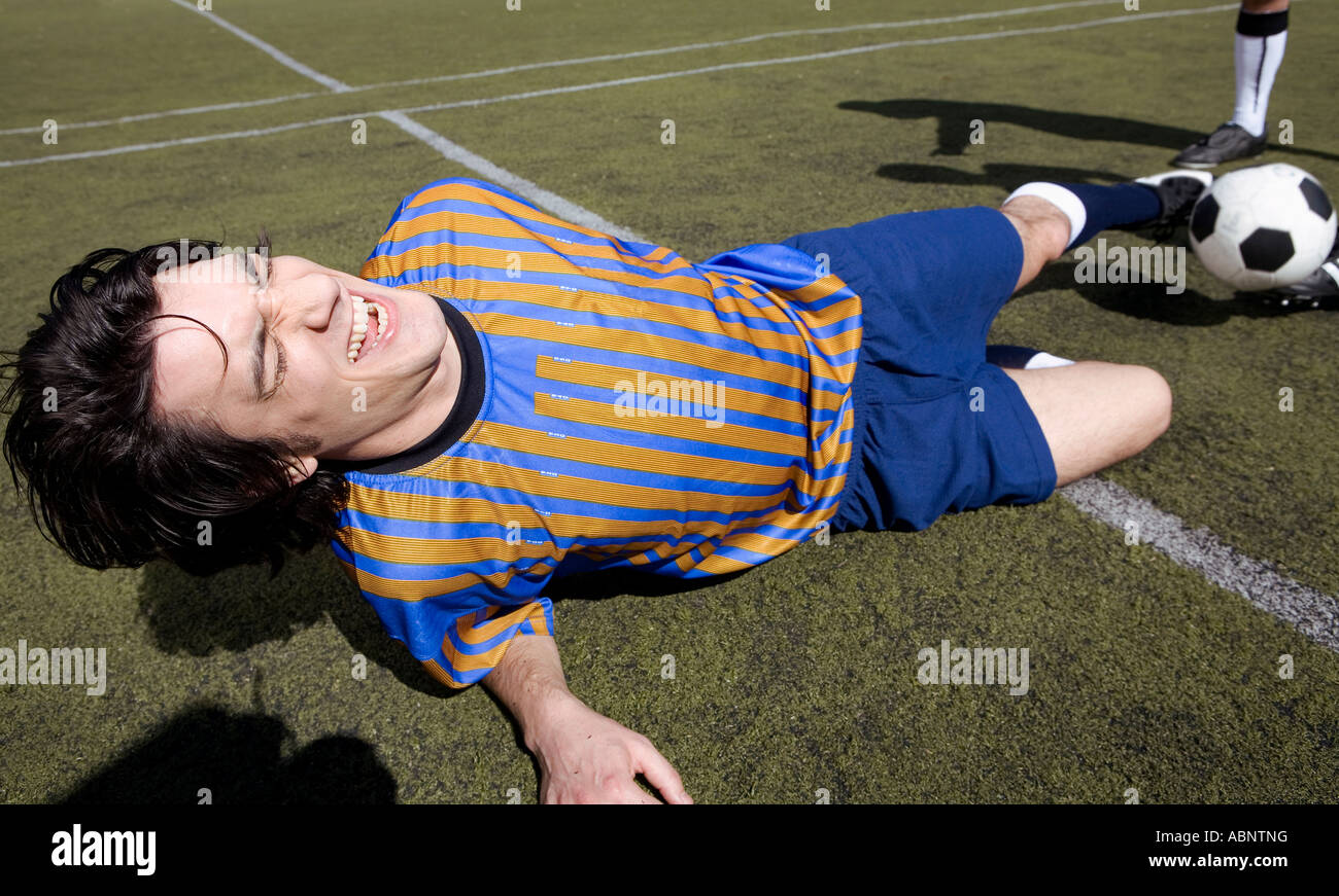 Injured soccer player Stock Photo - Alamy