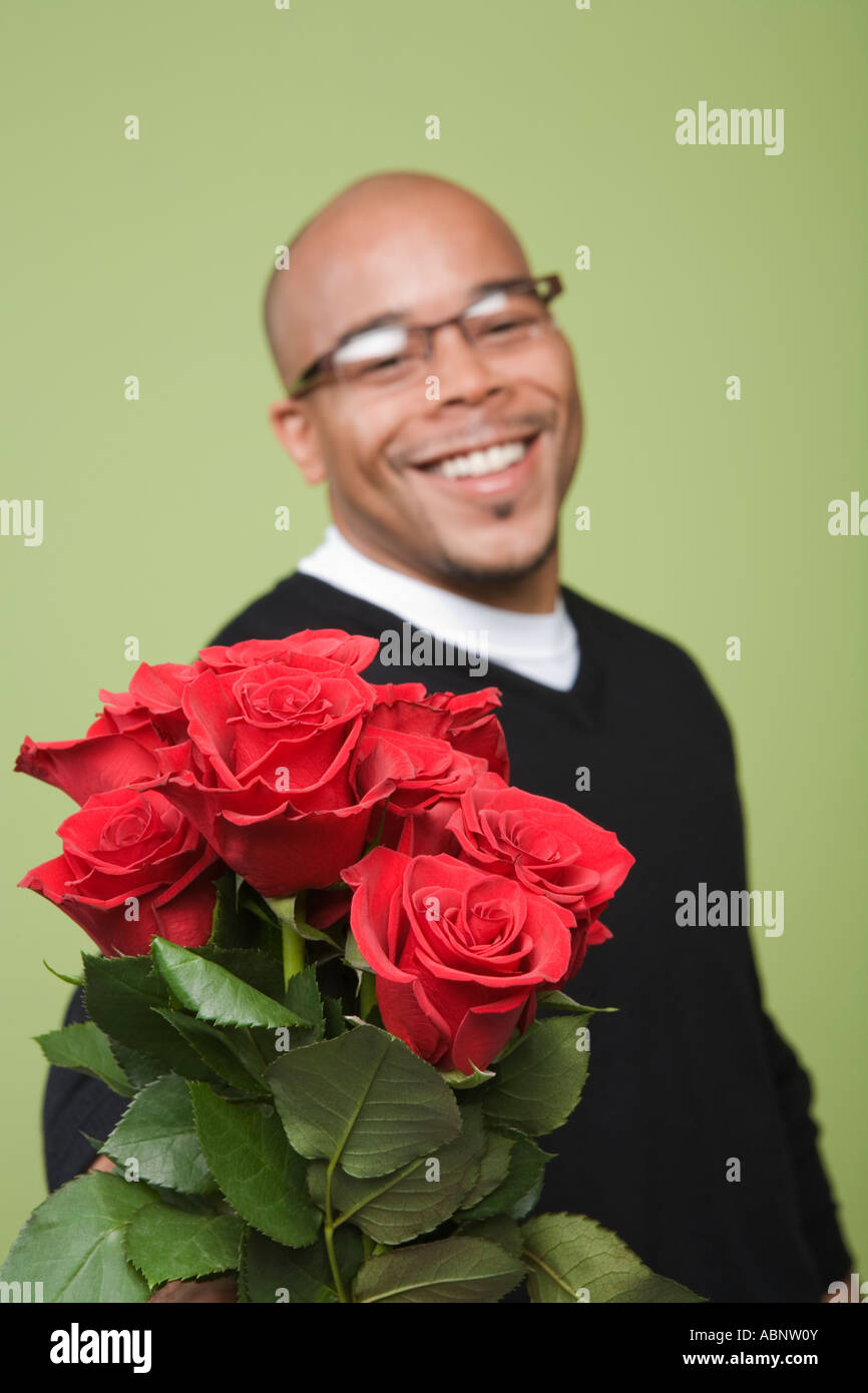Man offering bouquet of roses Stock Photo - Alamy