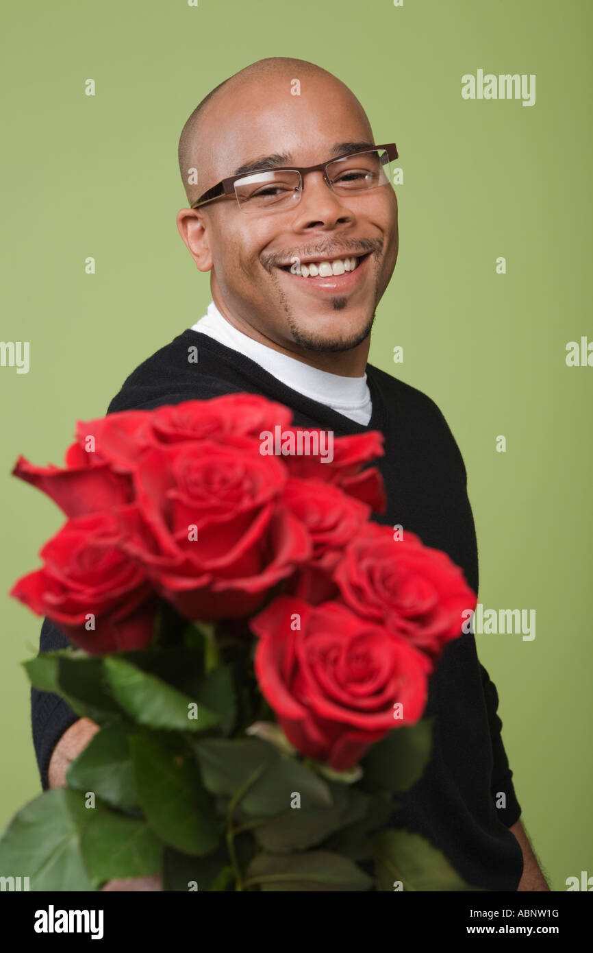 Man offering bouquet of roses Stock Photo - Alamy