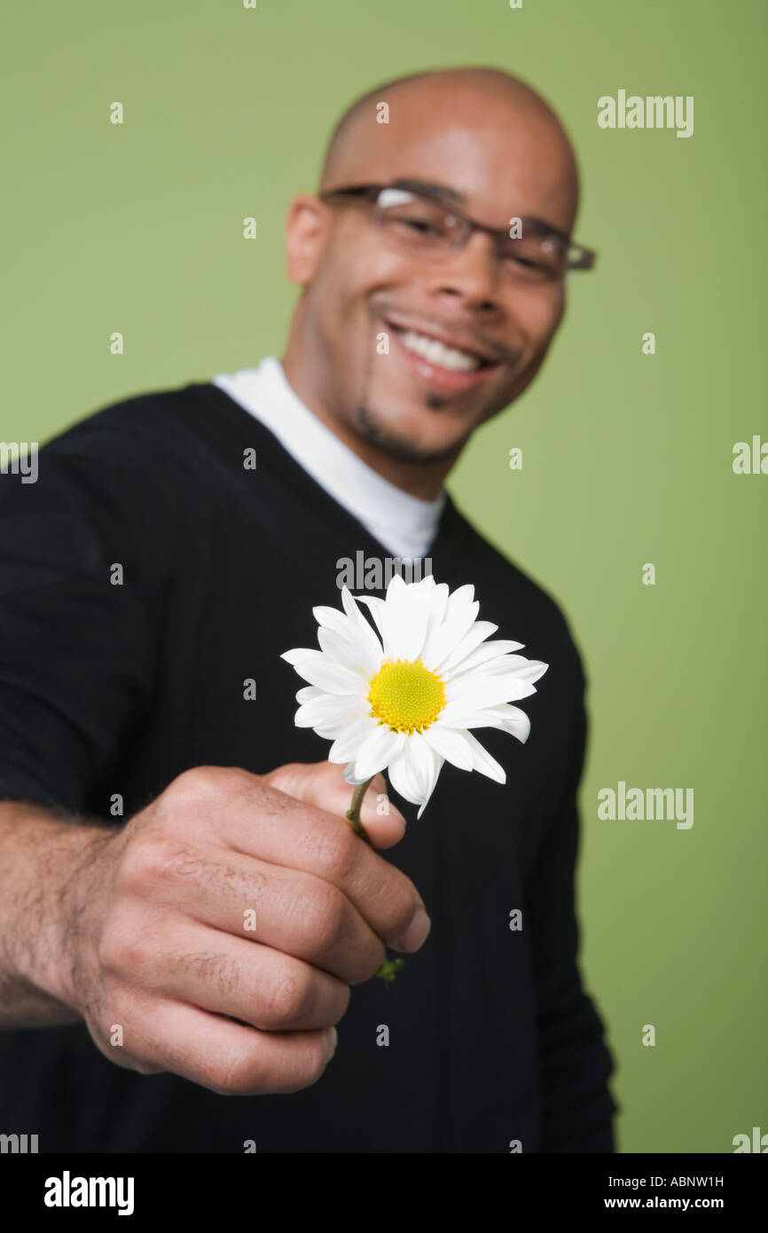 Man offering flower Stock Photo - Alamy