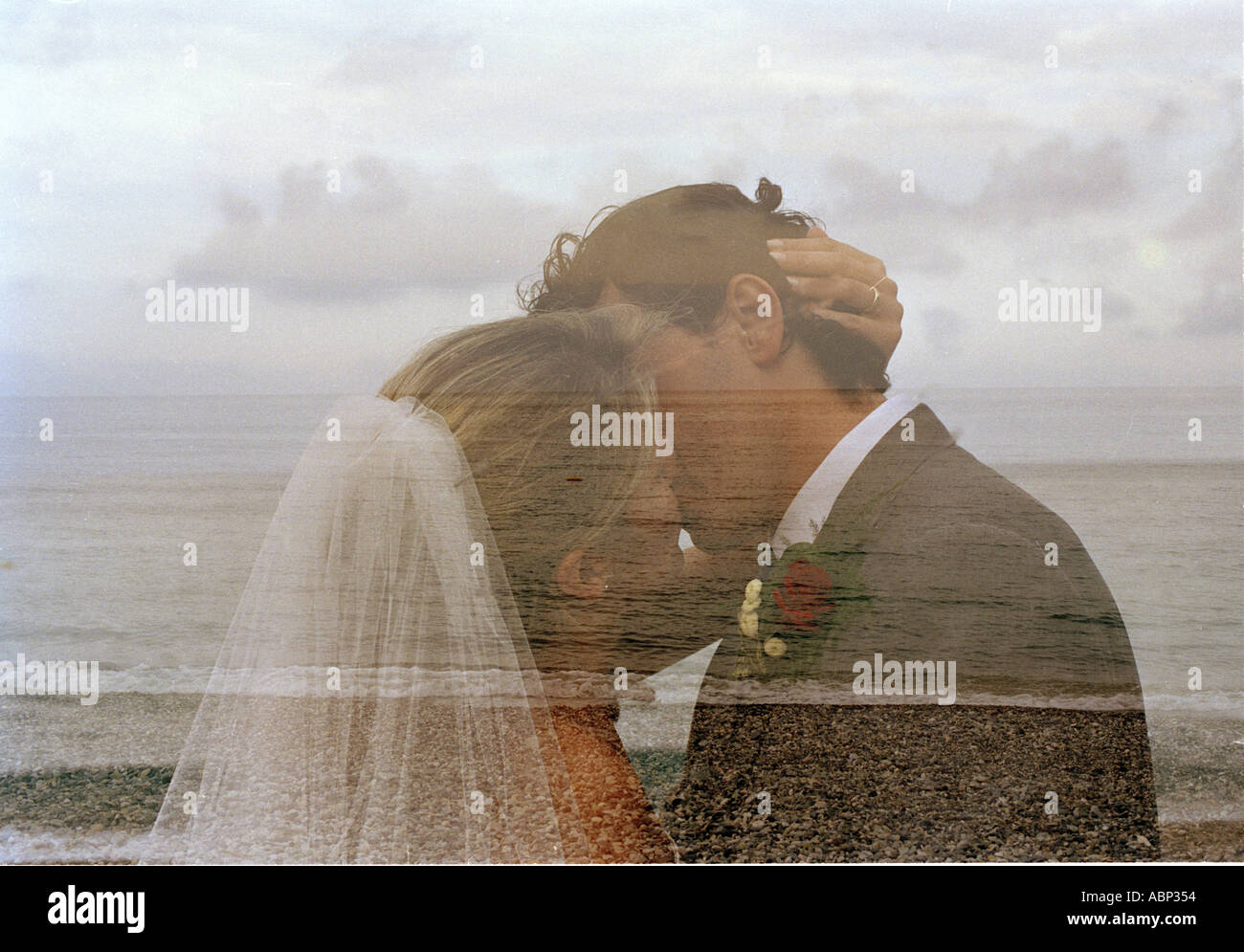 Married couple kissing Stock Photo - Alamy