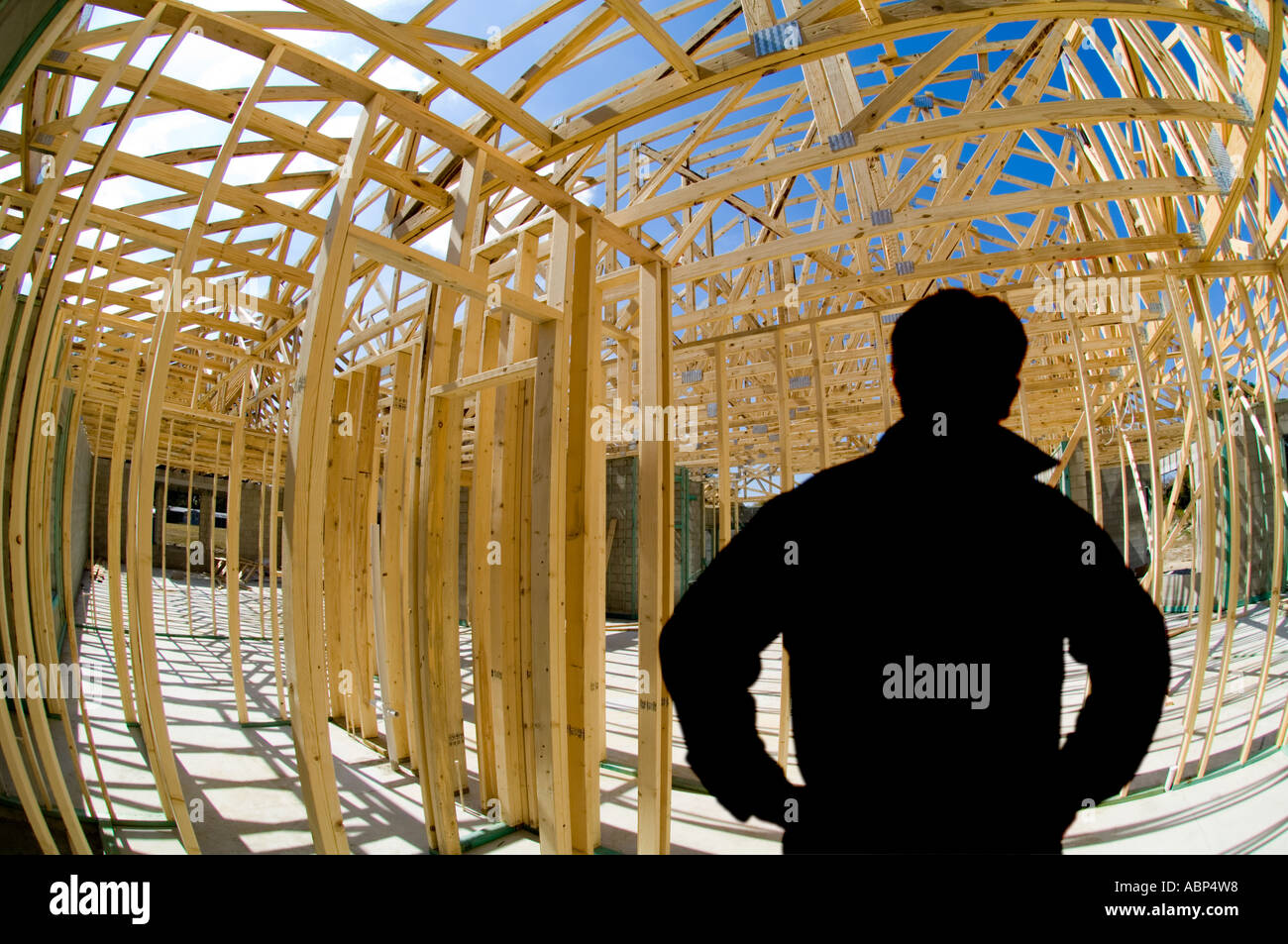 contractor on building site surveying construction progress Stock Photo ...