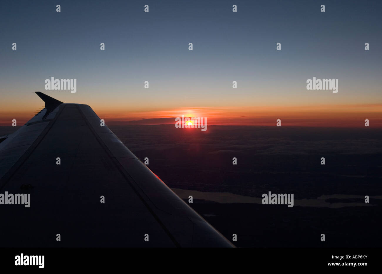 Sunrise seen from commercial airplane Stock Photo - Alamy