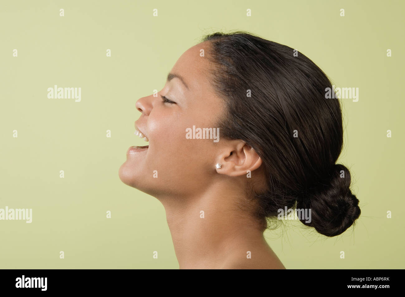 Profile view of woman laughing Stock Photo - Alamy