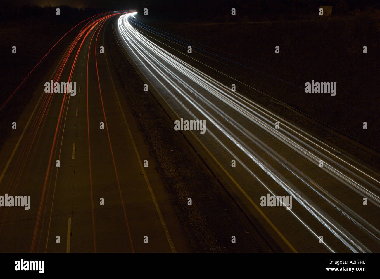road at night time with cars going by Stock Photo - Alamy