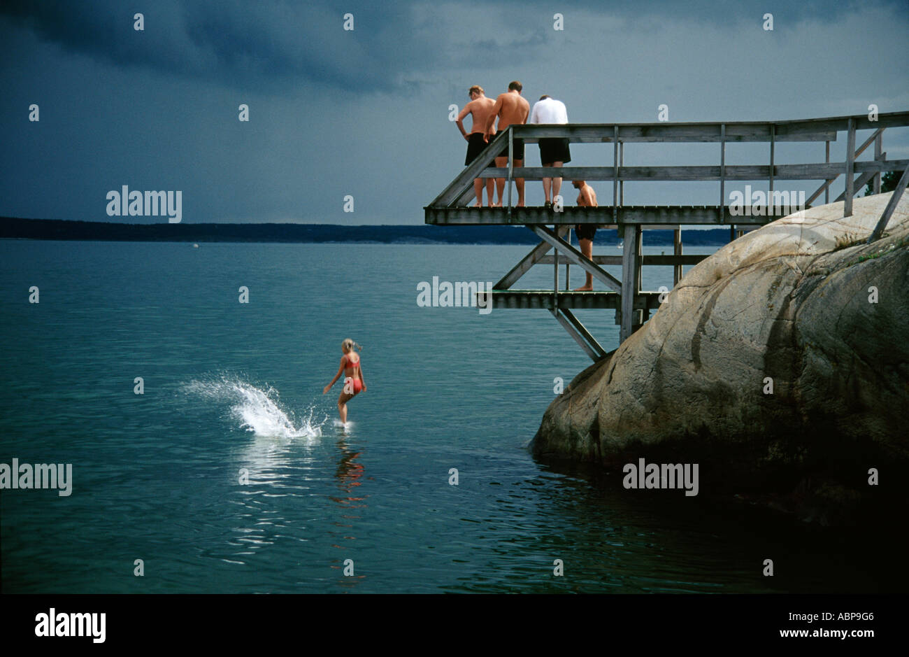 Jumping into the water Stock Photo - Alamy