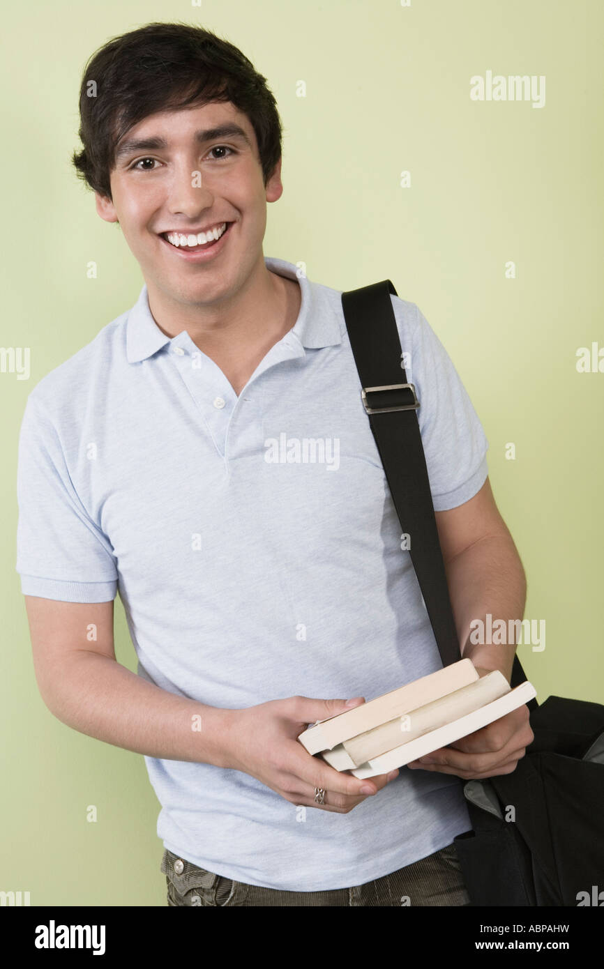 Man carrying books Stock Photo - Alamy