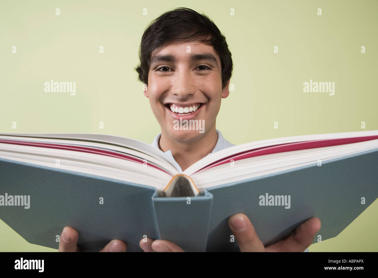 Man offering book Stock Photo - Alamy
