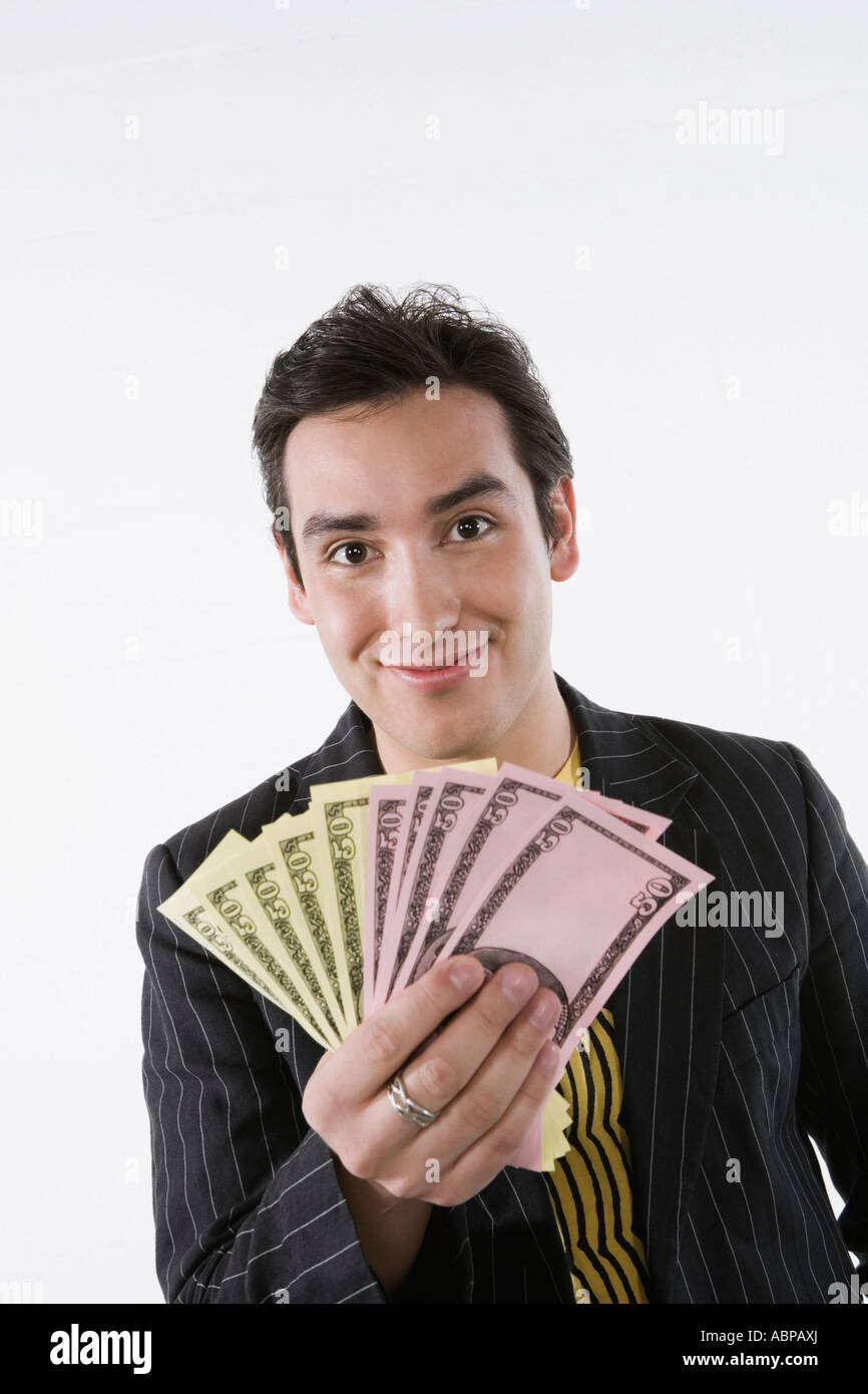 Man displaying fake money Stock Photo - Alamy