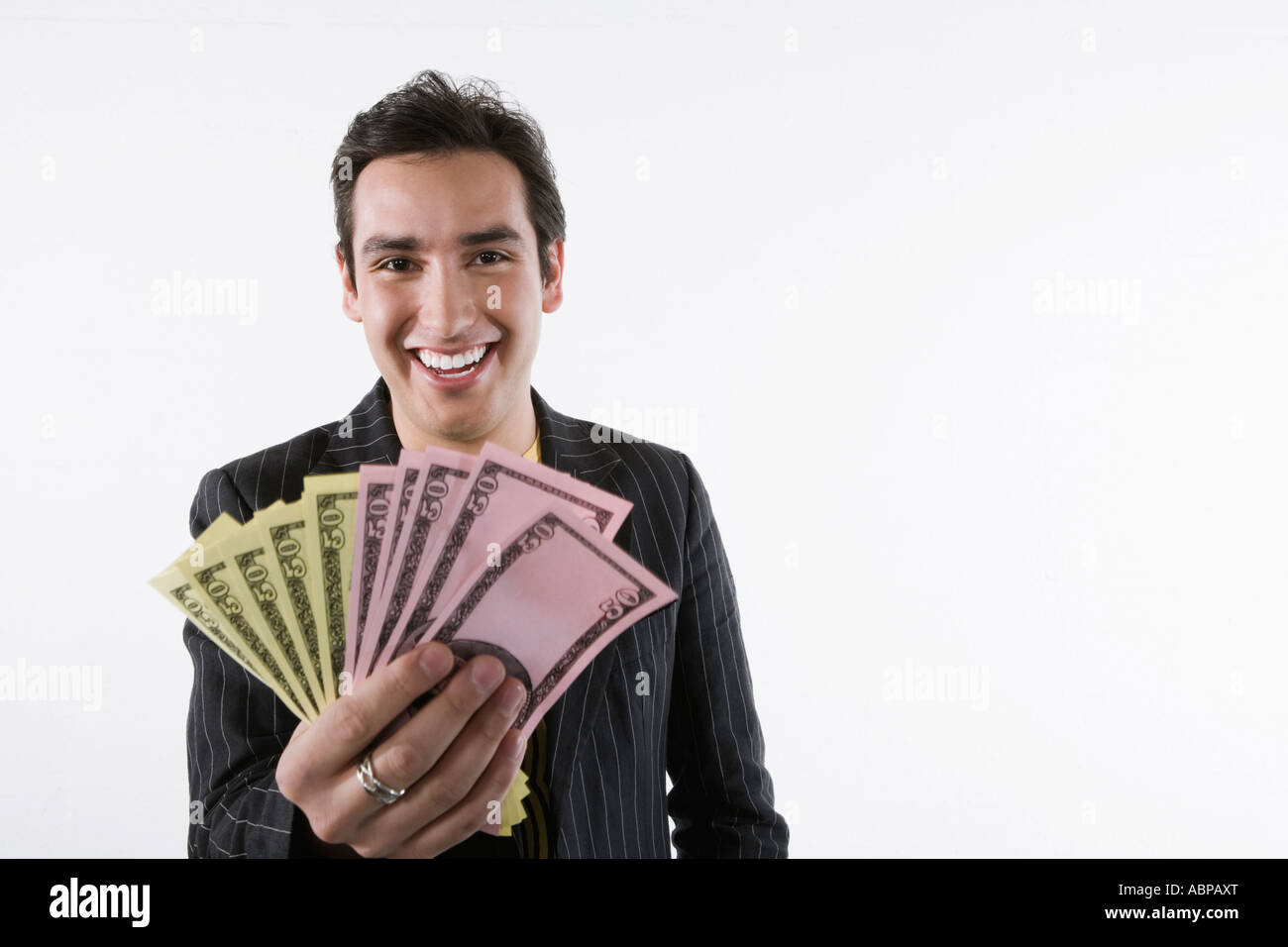 Man displaying fake money Stock Photo - Alamy