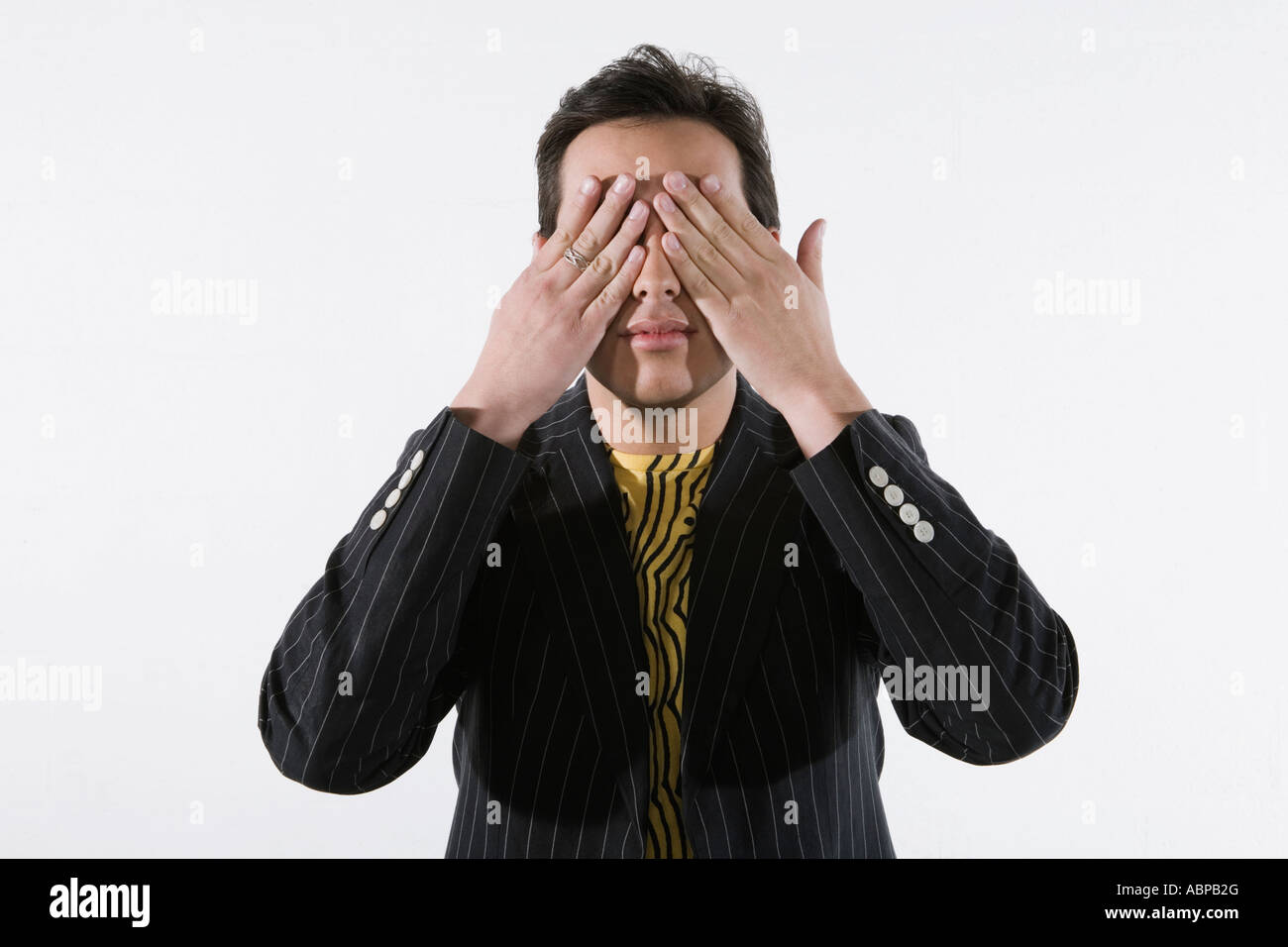 Man covering his eyes Stock Photo - Alamy