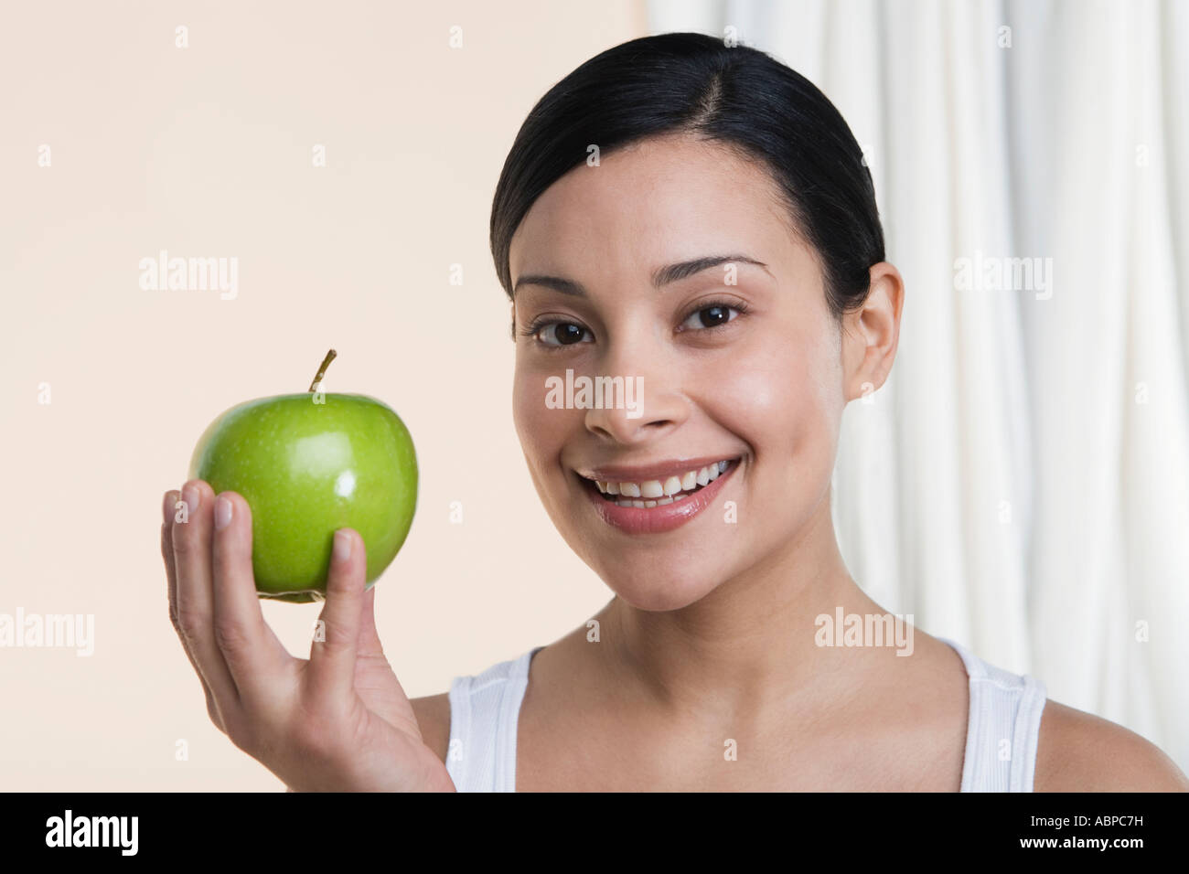 Woman holding apple Stock Photo - Alamy