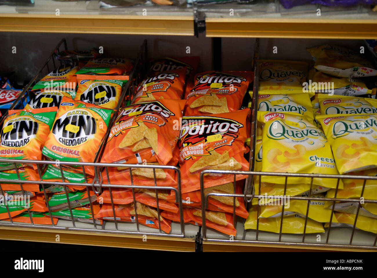 crisps and packets of savoury snacks for sale in shop Stock Photo - Alamy