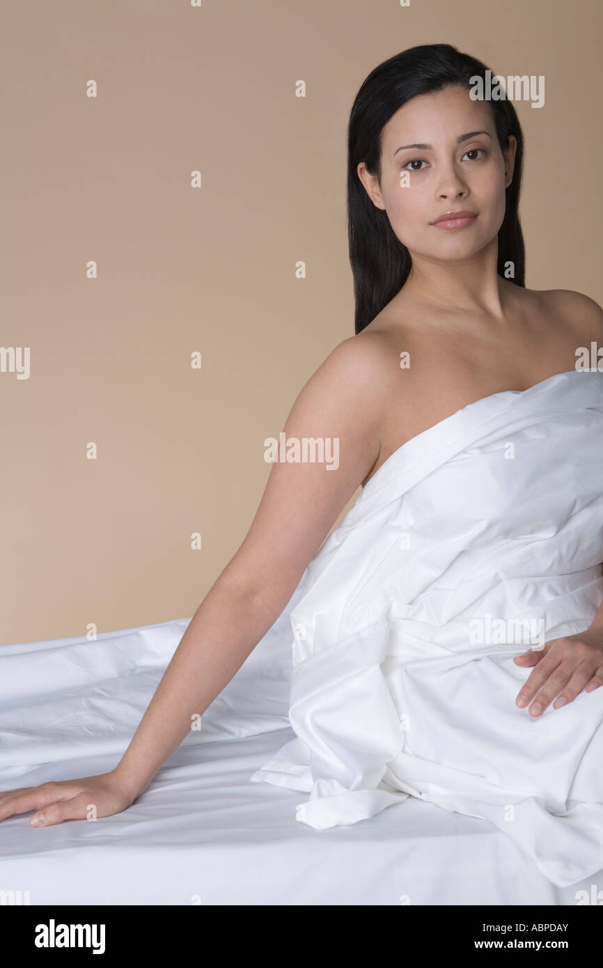 Woman wrapped in sheet Stock Photo - Alamy
