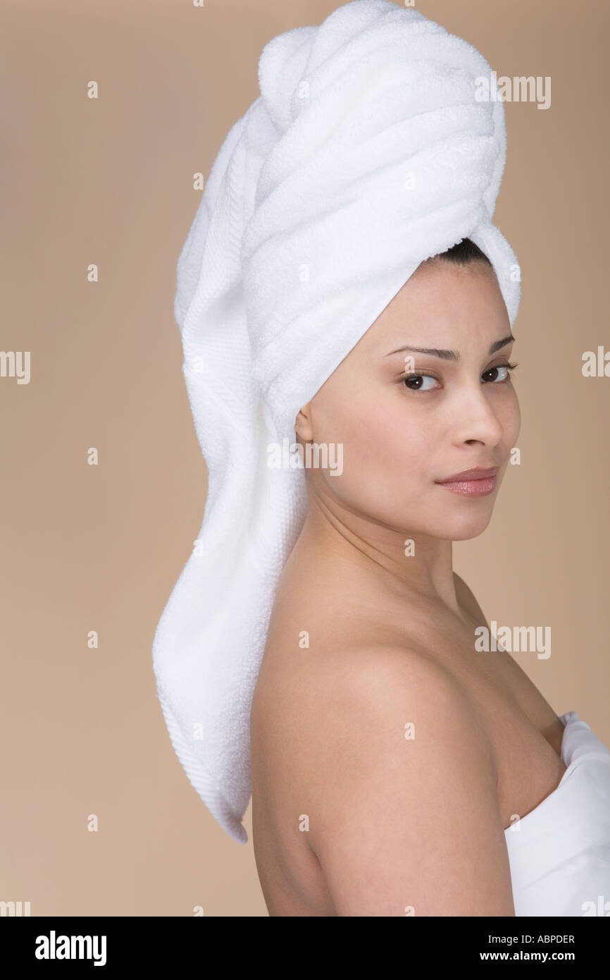 Woman wrapped in towels Stock Photo - Alamy