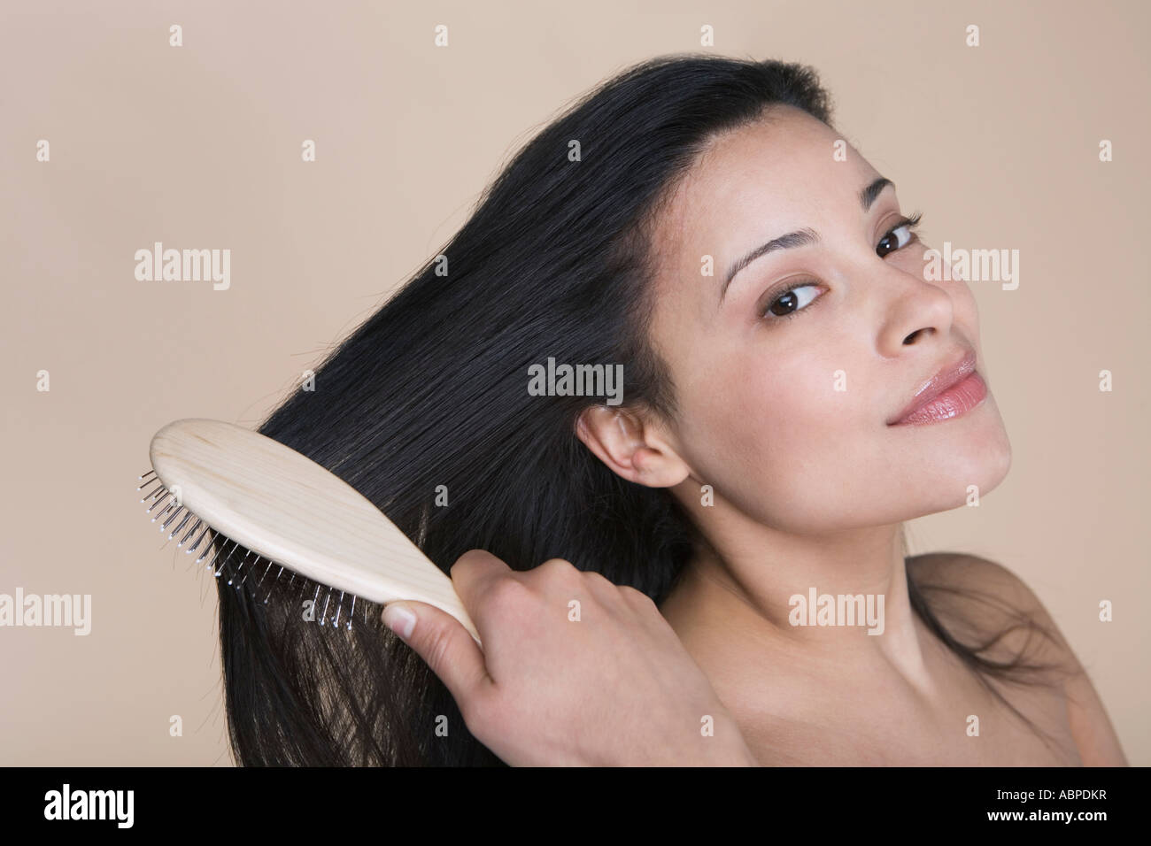 Brushing her hair Stock Photo - Alamy
